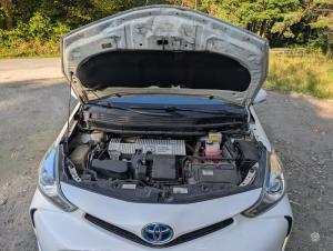 White Toyota Prius 2018 in Klaipeda, with an engine capacity of 1.80 L and mileage of 276 thousand km for 12800 €, photo 23 on AUTOMOTO.COM.LV