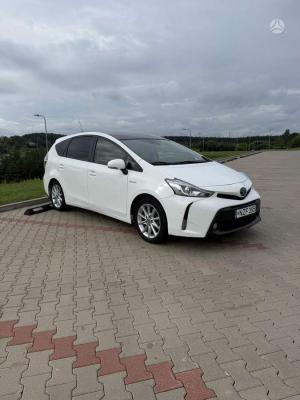 White Toyota Prius 2020 in Vilnius, with an engine capacity of 1.80 L and mileage of 302 thousand km for 12500 €, photo  on AUTOMOTO.COM.LV