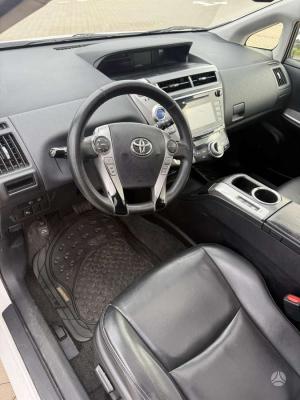White Toyota Prius 2020 in Vilnius, with an engine capacity of 1.80 L and mileage of 302 thousand km for 12500 €, photo 8 on AUTOMOTO.COM.LV