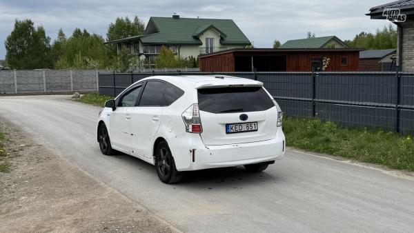 White Toyota Prius 2014 in Vilnius, with an engine capacity of 1.80 L and mileage of 400 thousand km for 6950 €, photo 8 on AUTOMOTO.COM.LV