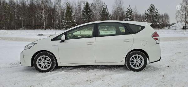 White Toyota Prius 2016 in Panevezys, with an engine capacity of 1.80 L and mileage of 282 thousand km for 8900 €, photo 2 on AUTOMOTO.COM.LV