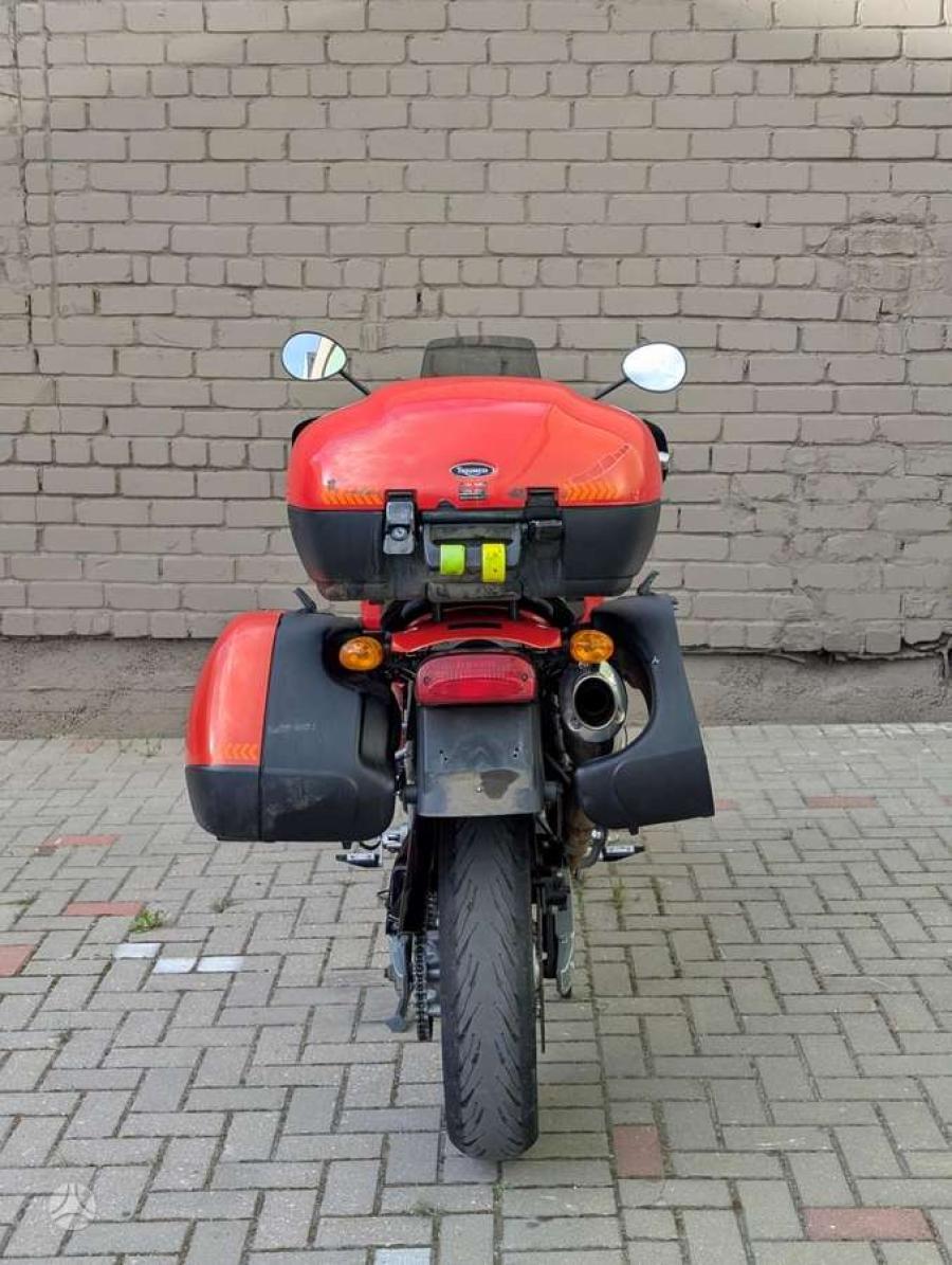 Oranžs Triumph Tiger 2005 Kauņa, ar dzinēja tilpumu 0.96 L un nobraukumu 34 tūkst. km par 2300 €, foto 6 vietnē AUTOMOTO.COM.LV
