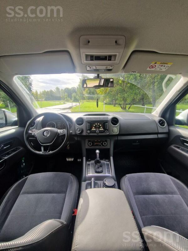 Black Volkswagen Amarok 2015 in Kuldiga, with an engine capacity of 2.00 L and mileage of 256 thousand km for 16800 €, photo 7 on AUTOMOTO.COM.LV