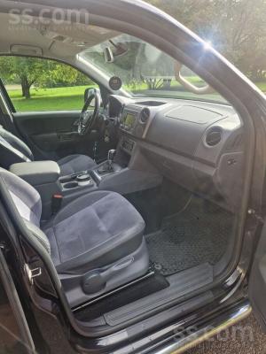 Black Volkswagen Amarok 2015 in Kuldiga, with an engine capacity of 2.00 L and mileage of 256 thousand km for 16800 €, photo 9 on AUTOMOTO.COM.LV