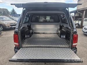 Black Volkswagen Amarok 2016 in Talsi, with an engine capacity of 2.00 L and mileage of 236 thousand km for 16800 €, photo 29 on AUTOMOTO.COM.LV