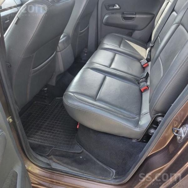 Brown Volkswagen Amarok 2011 in Riga, with an engine capacity of 2.00 L and mileage of 346 thousand km for 8599 €, photo 10 on AUTOMOTO.COM.LV