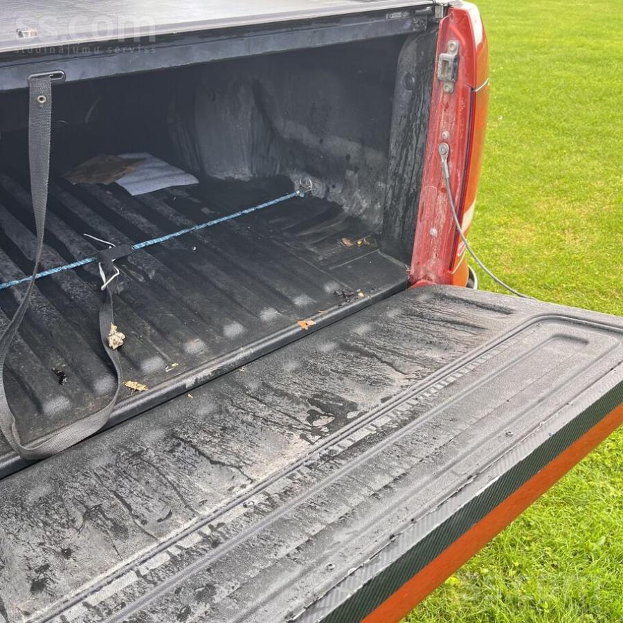 Orange Volkswagen Amarok 2014 in Bauska, with an engine capacity of 2.00 L and mileage of 245 thousand km for 11500 €, photo 9 on AUTOMOTO.COM.LV