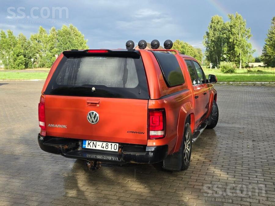 Orange Volkswagen Amarok 2014 in Jekabpils, with an engine capacity of 1.90 L and mileage of 327 thousand km for 13200 €, photo 4 on AUTOMOTO.COM.LV