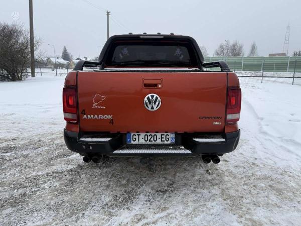 Orange Volkswagen Amarok 2015 in Taurage, with an engine capacity of 1.97 L and mileage of 232 thousand km for 14900 €, photo 9 on AUTOMOTO.COM.LV