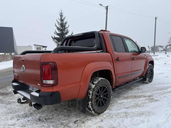 Orange Volkswagen Amarok 2015 in Taurage, with an engine capacity of 1.97 L and mileage of 232 thousand km for 14900 €, photo 10 on AUTOMOTO.COM.LV