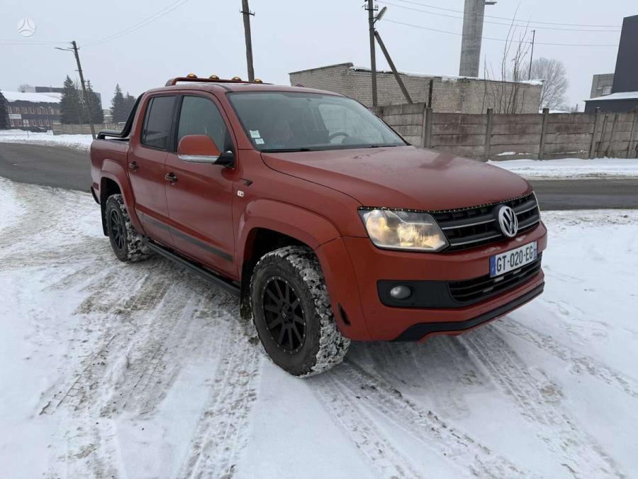 Orange Volkswagen Amarok 2015 in Taurage, with an engine capacity of 1.97 L and mileage of 232 thousand km for 14900 €, photo 5 on AUTOMOTO.COM.LV