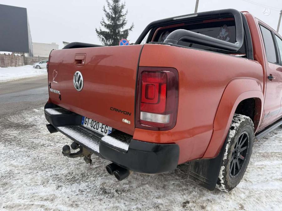 Orange Volkswagen Amarok 2015 in Taurage, with an engine capacity of 1.97 L and mileage of 232 thousand km for 14900 €, photo 11 on AUTOMOTO.COM.LV
