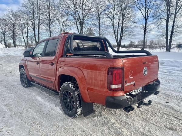 Orange Volkswagen Amarok 2015 in Taurage, with an engine capacity of 1.97 L and mileage of 230 thousand km for 14700 €, photo 9 on AUTOMOTO.COM.LV