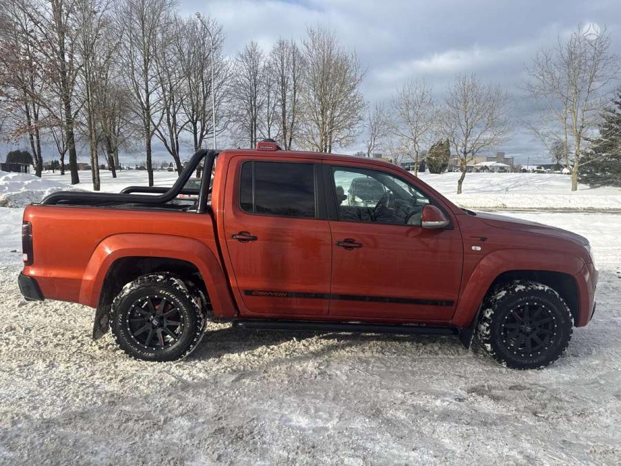 Orange Volkswagen Amarok 2015 in Taurage, with an engine capacity of 1.97 L and mileage of 230 thousand km for 14700 €, photo 11 on AUTOMOTO.COM.LV