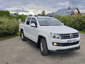 White Volkswagen Amarok 2015 in Riga, with an engine capacity of 2.00 L and mileage of 190 thousand km for 14500 €, photo 9 on AUTOMOTO.COM.LV
