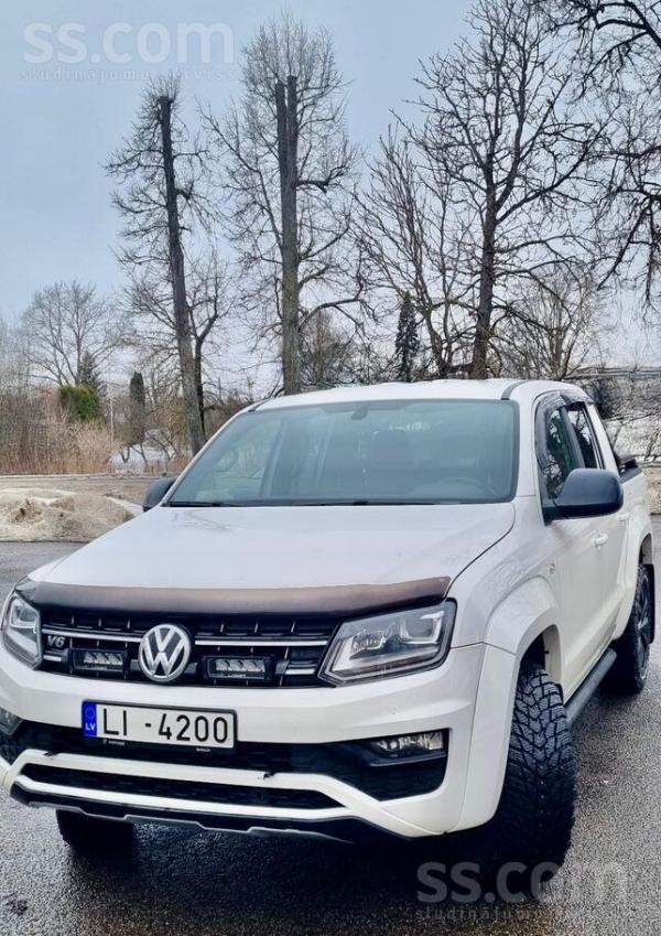 White Volkswagen Amarok 2020 in Ogre, with an engine capacity of 3.00 L and mileage of 156 thousand km for 28800 €, photo 1 on AUTOMOTO.COM.LV