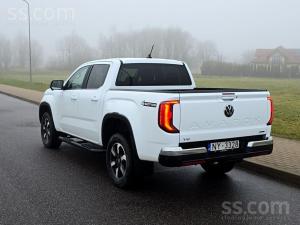 White Volkswagen Amarok 2024 in Riga, with an engine capacity of 3.00 L and mileage of 105 thousand km for 40500 €, photo 3 on AUTOMOTO.COM.LV