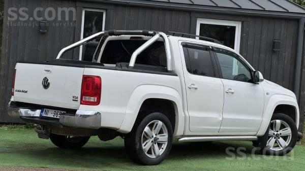 White Volkswagen Amarok 2012 in Riga, with an engine capacity of 2.00 L and mileage of 349 thousand km for 6500 €, photo 3 on AUTOMOTO.COM.LV