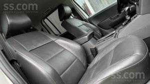 White Volkswagen Amarok 2012 in Riga, with an engine capacity of 2.00 L and mileage of 349 thousand km for 6500 €, photo 8 on AUTOMOTO.COM.LV