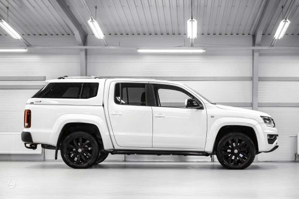 White Volkswagen Amarok 2020 in Tukums, with an engine capacity of 2.97 L and mileage of 185 thousand km for 25700 €, photo 4 on AUTOMOTO.COM.LV