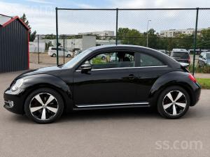 Black Volkswagen Beetle 2011 in Riga, with an engine capacity of 2.00 L and mileage of 215 thousand km for 7990 €, photo 3 on AUTOMOTO.COM.LV