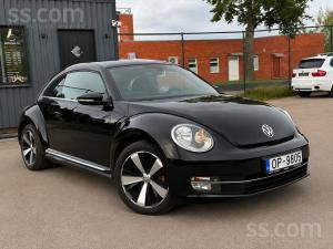 Black Volkswagen Beetle 2011 in Riga, with an engine capacity of 2.00 L and mileage of 215 thousand km for 7990 €, photo 6 on AUTOMOTO.COM.LV