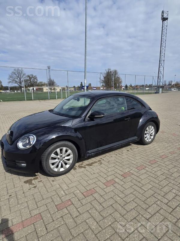 Black Volkswagen Beetle 2011 in Valmiera, with an engine capacity of 1.20 L and mileage of 144 thousand km for 6000 €, photo 1 on AUTOMOTO.COM.LV