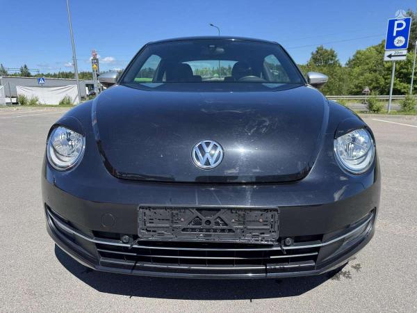 Black Volkswagen Beetle 2012 in Vilnius, with an engine capacity of 1.98 L and mileage of 210 thousand km for 6400 €, photo 2 on AUTOMOTO.COM.LV