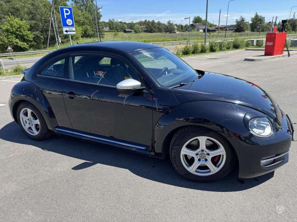 Black Volkswagen Beetle 2012 in Vilnius, with an engine capacity of 1.98 L and mileage of 210 thousand km for 6400 €, photo 6 on AUTOMOTO.COM.LV
