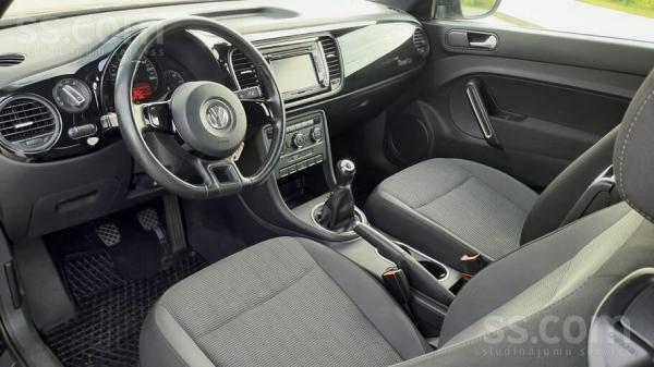 Black Volkswagen Beetle 2012 in Riga, with an engine capacity of 1.20 L and mileage of 224 thousand km for 4000 €, photo 7 on AUTOMOTO.COM.LV