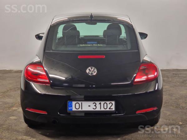 Black Volkswagen Beetle 2014 in Riga, with an engine capacity of 1.20 L and mileage of 230 thousand km for 4850 €, photo 7 on AUTOMOTO.COM.LV