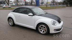 White Volkswagen Beetle 2013 in Riga, with an engine capacity of 1.60 L and mileage of 254 thousand km for 6350 €, photo 26 on AUTOMOTO.COM.LV