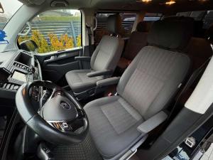 Black Volkswagen Caravelle 2016 in Klaipeda, with an engine capacity of 2.00 L and mileage of 290 thousand km for 17999 €, photo 3 on AUTOMOTO.COM.LV
