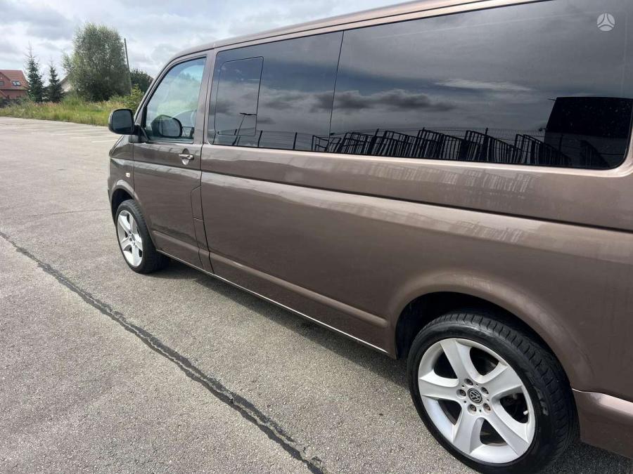 Brown Volkswagen Caravelle 2010 in Panevezys, with an engine capacity of 1.97 L and mileage of 403 thousand km for 11300 €, photo 6 on AUTOMOTO.COM.LV