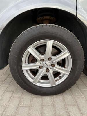 Grey Volkswagen Caravelle 2012 in Utena, with an engine capacity of 2.00 L and mileage of 298 thousand km for 12200 €, photo 27 on AUTOMOTO.COM.LV