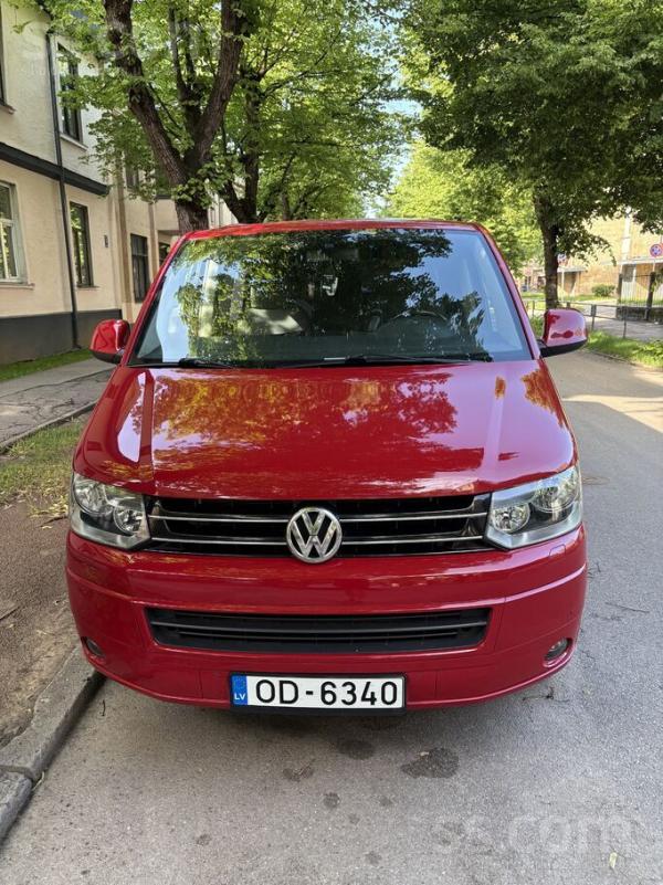 Red Volkswagen Caravelle 2010 in Riga, with an engine capacity of 2.00 L and mileage of 428 thousand km for 9500 €, photo 1 on AUTOMOTO.COM.LV