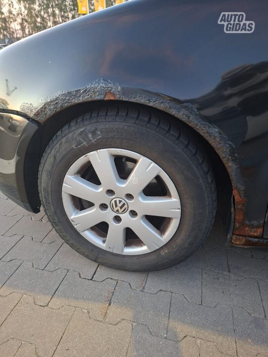 Melns Volkswagen Golf 2009 Viļņa, ar dzinēja tilpumu 1.90 L un nobraukumu 299 tūkst. km par 1500 €, foto 18 vietnē AUTOMOTO.COM.LV