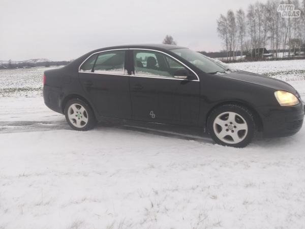Black Volkswagen Jetta 2010 in Vilnius, with an engine capacity of 1.40 L and mileage of 258 thousand km for 1250 €, photo 2 on AUTOMOTO.COM.LV
