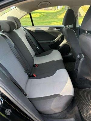 Black Volkswagen Jetta 2024 in Kaunas, with an engine capacity of 1.40 L and mileage of 187 thousand km for 6800 €, photo 8 on AUTOMOTO.COM.LV