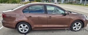 Brown Volkswagen Jetta 2017 in Riga, with an engine capacity of 2.00 L and mileage of 122 thousand km for 6800 €, photo 6 on AUTOMOTO.COM.LV