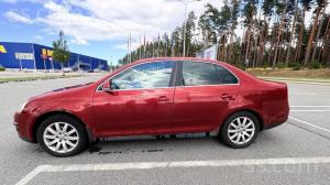 Red Volkswagen Jetta 2007 in Riga, with an engine capacity of 1.60 L and mileage of 261 thousand km for 1200 €, photo  on AUTOMOTO.COM.LV