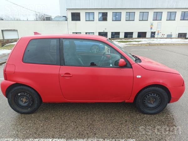 Red Volkswagen Lupo 2000 in Riga, with an engine capacity of 1.40 L and mileage of 392 thousand km for 950 €, photo 2 on AUTOMOTO.COM.LV