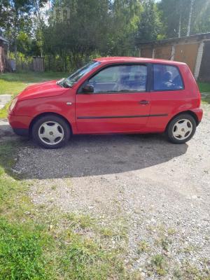 Red Volkswagen Lupo 2003 in Riga, with an engine capacity of 1.00 L and mileage of 180 thousand km for 1300 €, photo 1 on AUTOMOTO.COM.LV