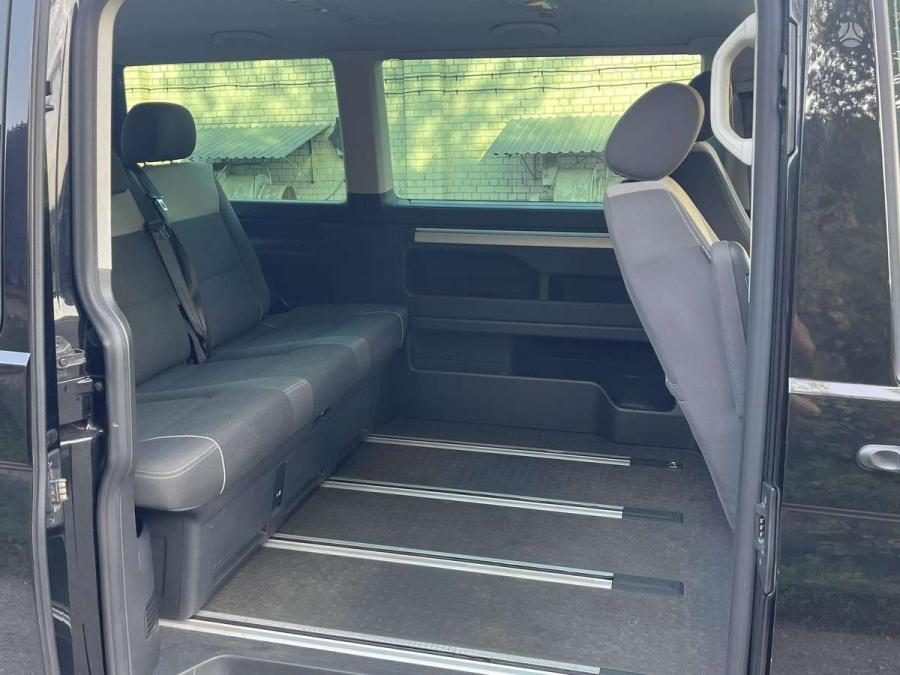 Black Volkswagen Multivan 2010 in Kaunas, with an engine capacity of 1.97 L and mileage of 276 thousand km for 9990 €, photo 20 on AUTOMOTO.COM.LV