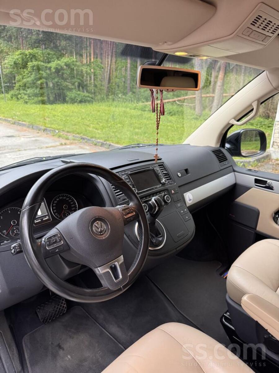 Black Volkswagen Multivan 2012 in Riga, with an engine capacity of 2.00 L and mileage of 216 thousand km for 18000 €, photo 8 on AUTOMOTO.COM.LV