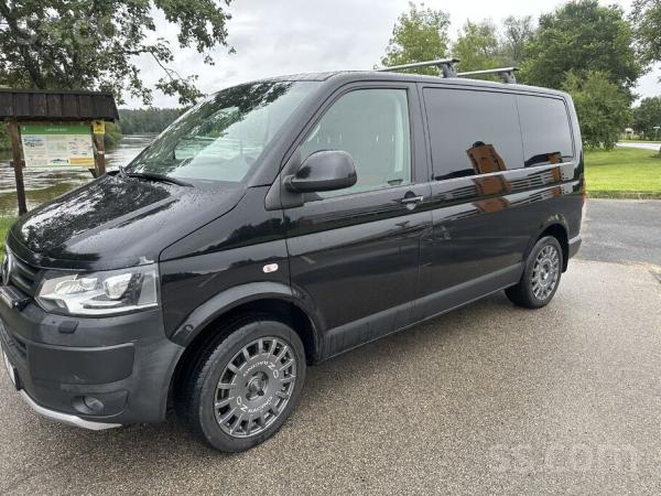 Black Volkswagen Multivan 2014 in Riga, with an engine capacity of 2.00 L and mileage of 210 thousand km for 27000 €, photo 4 on AUTOMOTO.COM.LV
