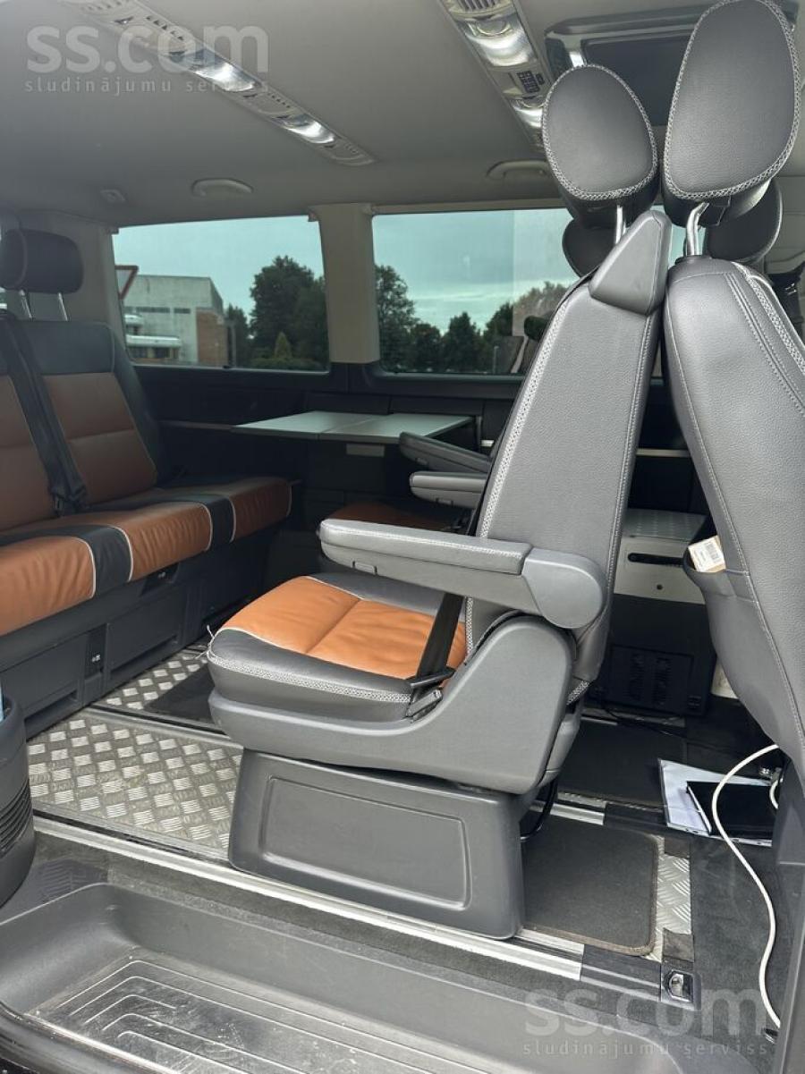 Black Volkswagen Multivan 2014 in Riga, with an engine capacity of 2.00 L and mileage of 224 thousand km for 23800 €, photo 14 on AUTOMOTO.COM.LV
