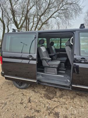 Black Volkswagen Multivan 2010 in Liepaja, with an engine capacity of 2.00 L and mileage of 251 thousand km for 14500 €, photo 4 on AUTOMOTO.COM.LV