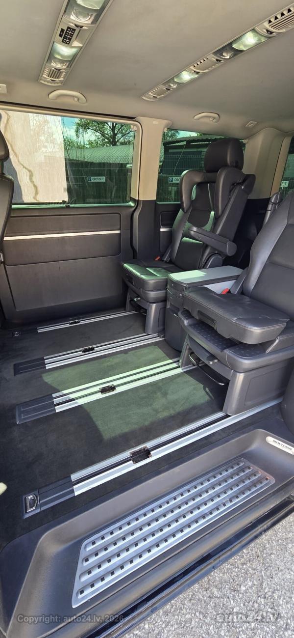 Black Volkswagen Multivan 2013 in Tartu, with an engine capacity of 2.00 L and mileage of 406 thousand km for 14990 €, photo 7 on AUTOMOTO.COM.LV