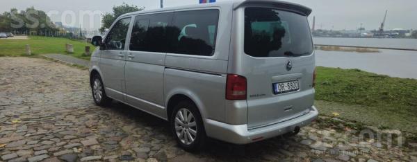 Grey Volkswagen Multivan 2011 in Riga, with an engine capacity of 2.00 L and mileage of 393 thousand km for 14300 €, photo 5 on AUTOMOTO.COM.LV